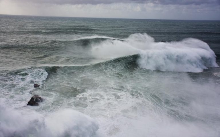 Dreaming of Big Waves: What Does it Mean? - DreamsDr